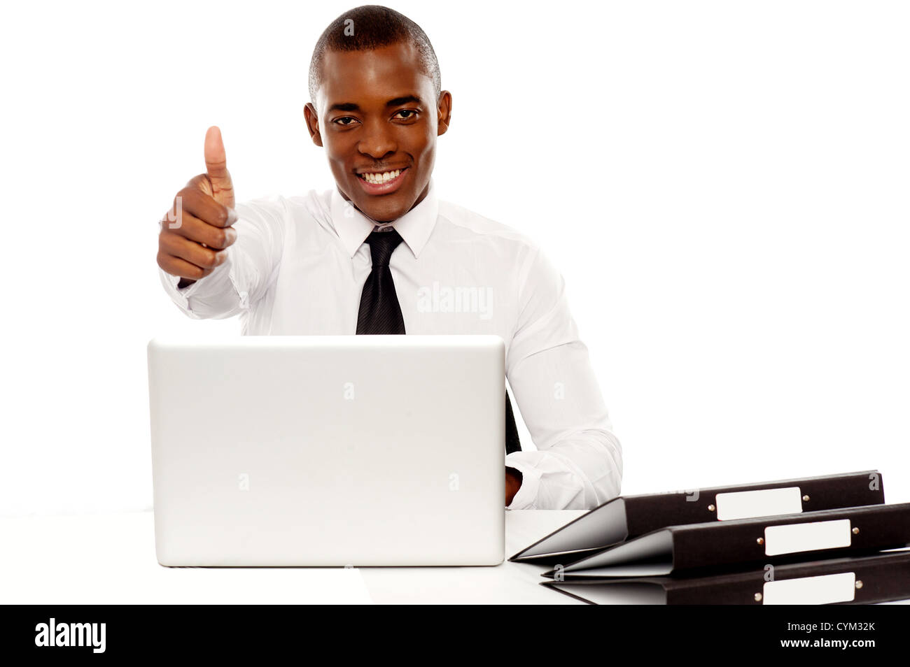 Happy young african gesturing thumbs up at camera Stock Photo - Alamy