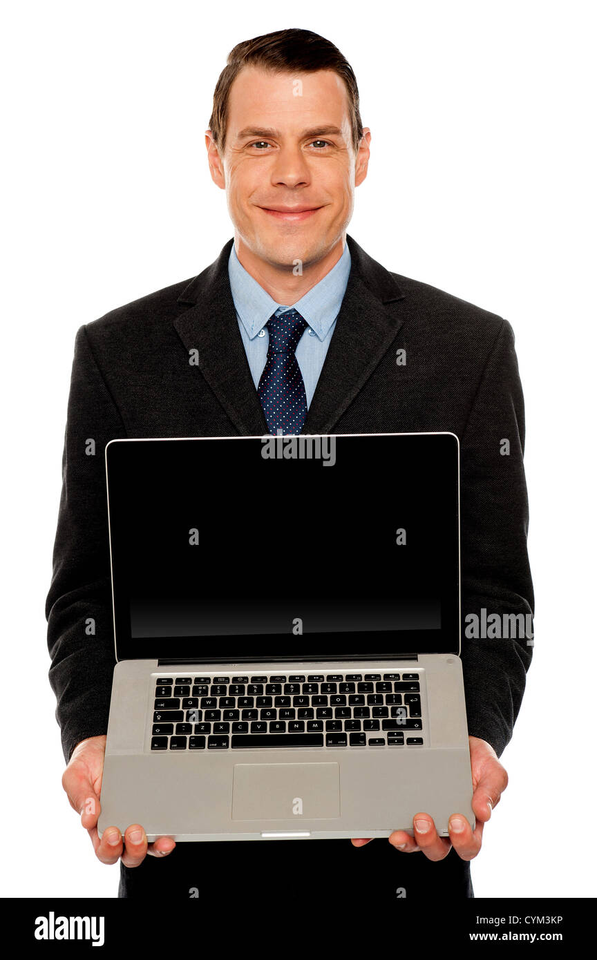 Smart businessman displaying laptop to you. All on white background ...