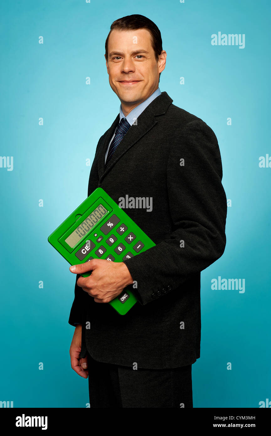 Side view portrait of a businessman with green calculator isolated over ...