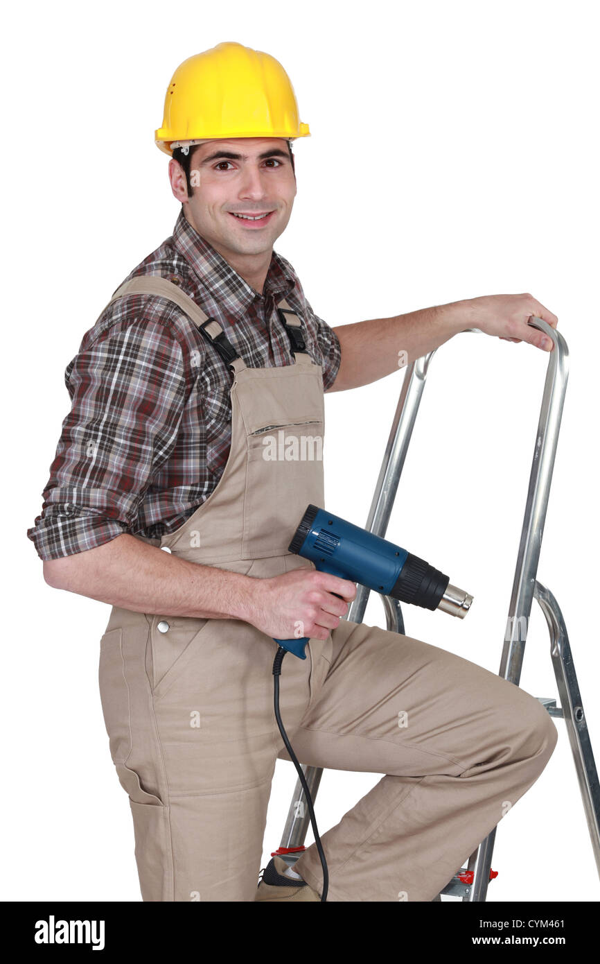 Manual worker climbing ladder Stock Photo - Alamy