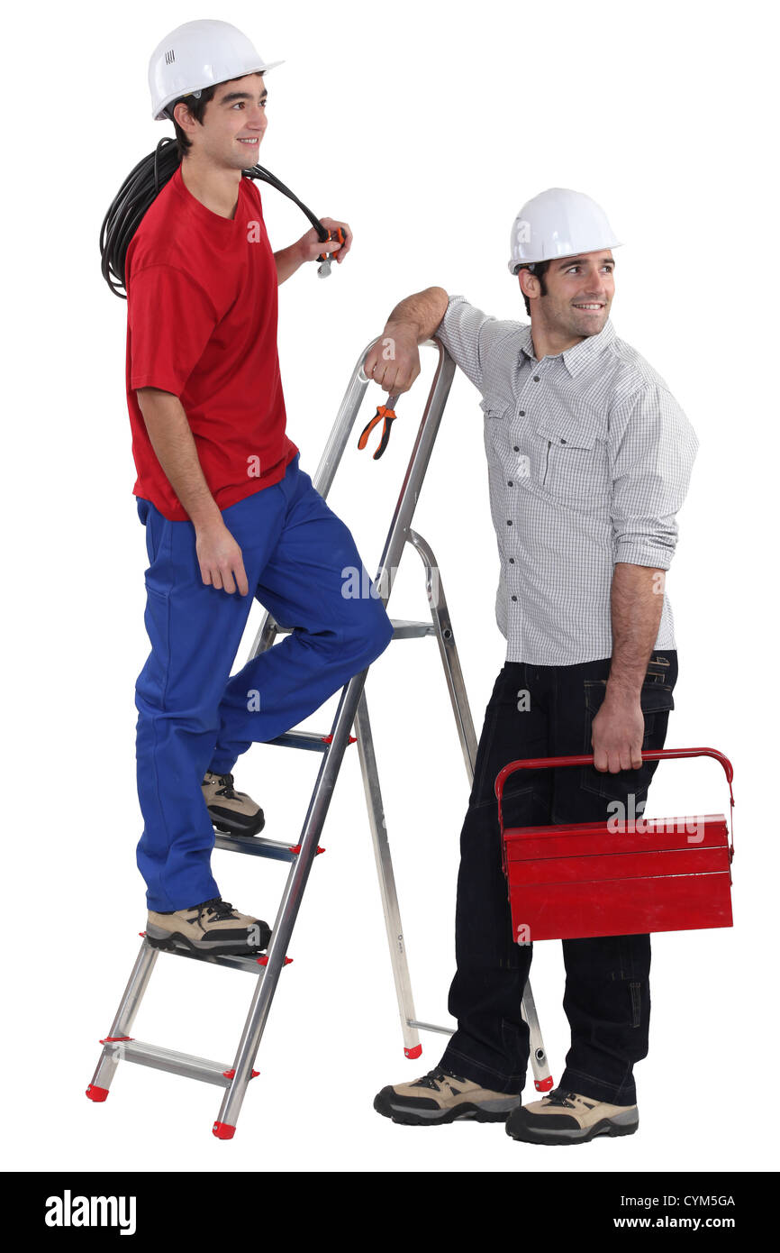 Two electrician collaborating on project Stock Photo - Alamy