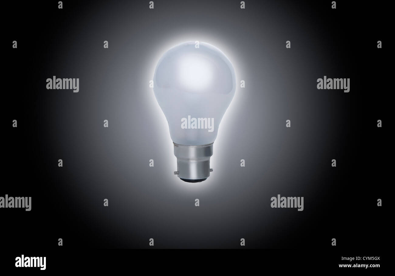Glowing lamp on black background Stock Photo - Alamy