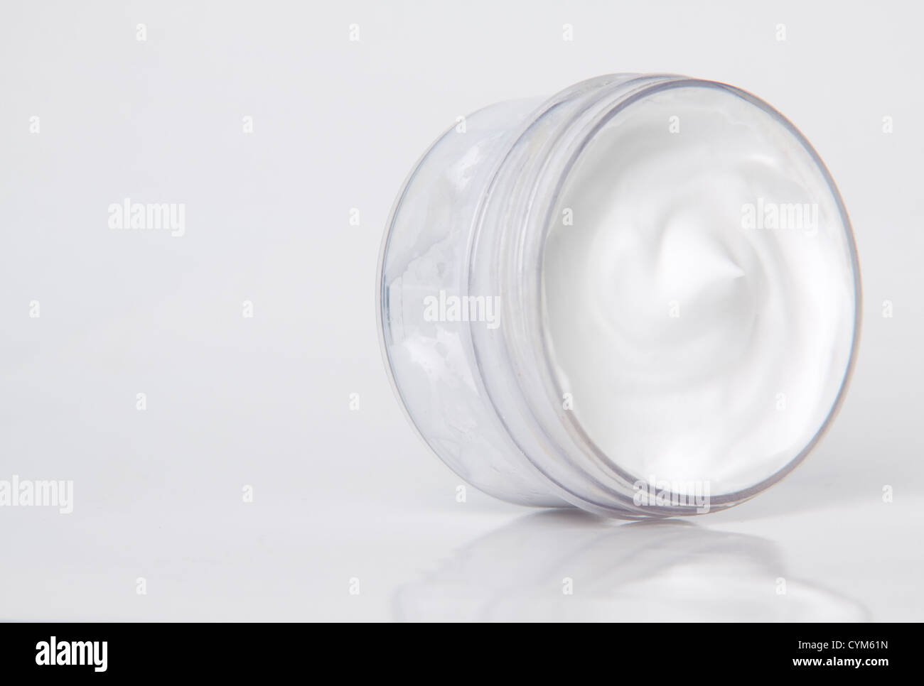 Pot of moisturizing face cream on white background Stock Photo - Alamy