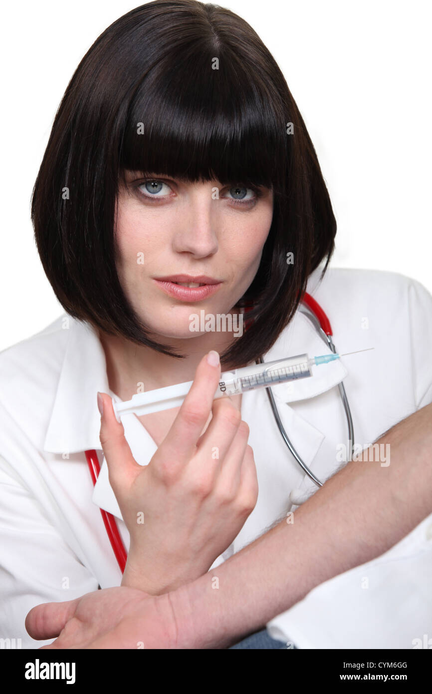a nurse giving an injection Stock Photo - Alamy