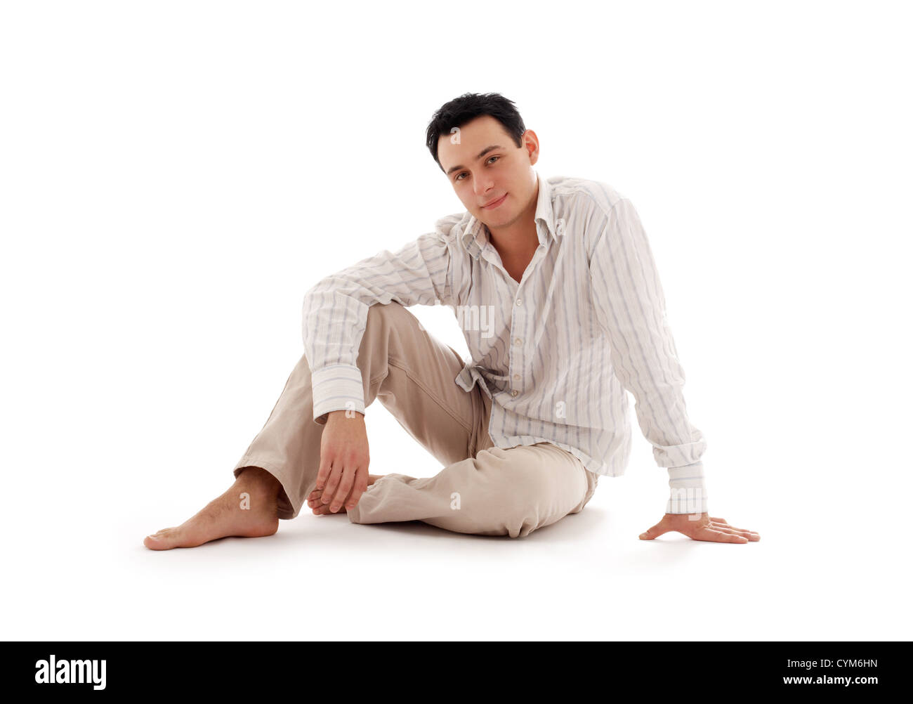 relaxed man sitting on the floor over white Stock Photo - Alamy