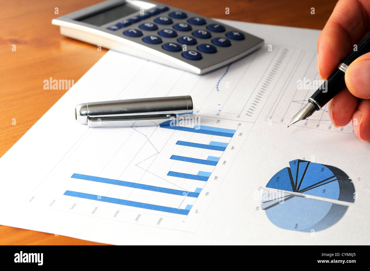 business data in office with hand witch calculator Stock Photo - Alamy