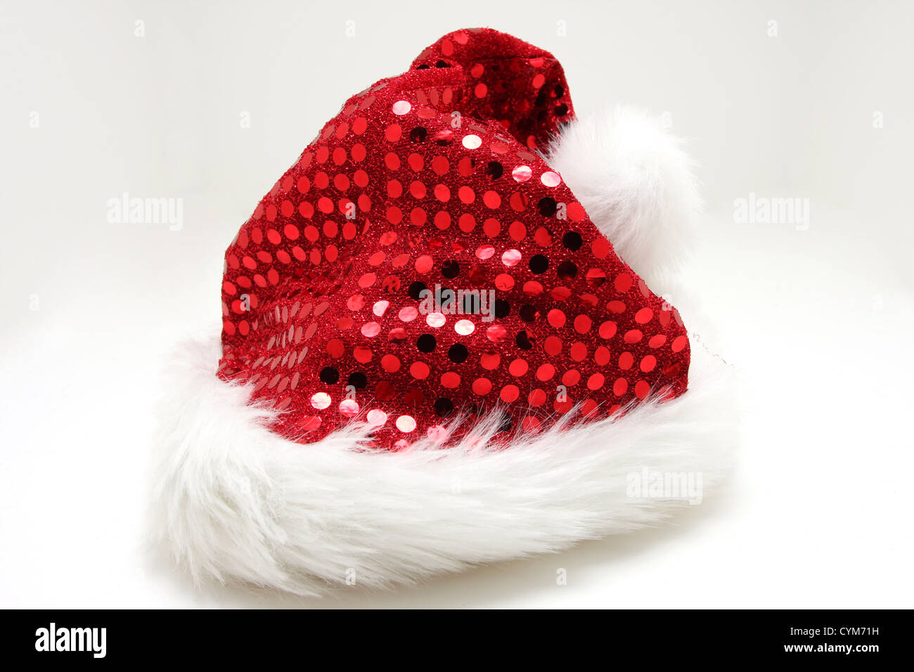 Santas hat on white, red glittering shingles on hat Stock Photo - Alamy
