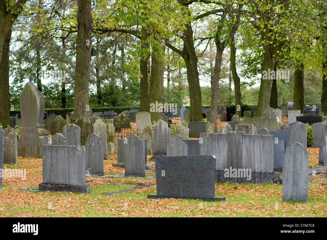 Several tombstones on a graveyard Stock Photo - Alamy