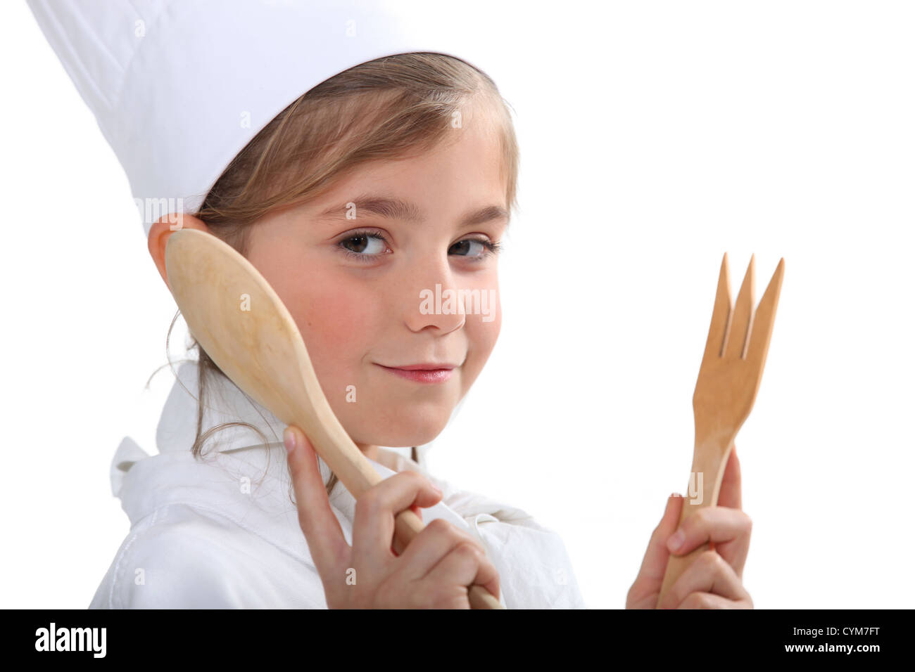 a little blonde girl dressed in chief cook Stock Photo - Alamy