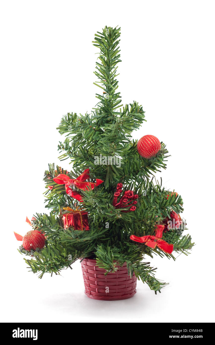 A small decorated Christmas tree on white background Stock Photo - Alamy