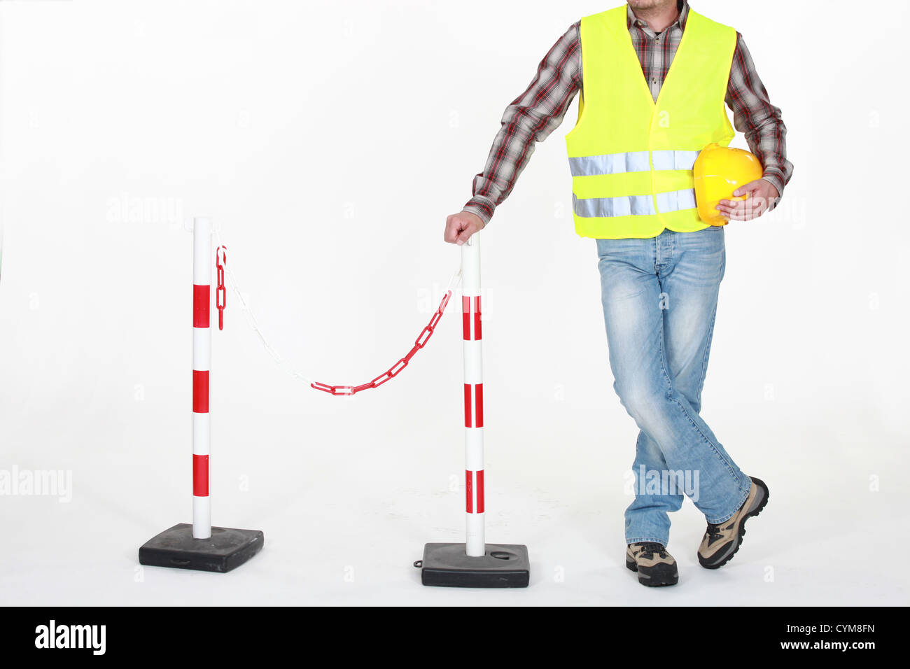 Traffic guard standing beside a barrier Stock Photo - Alamy