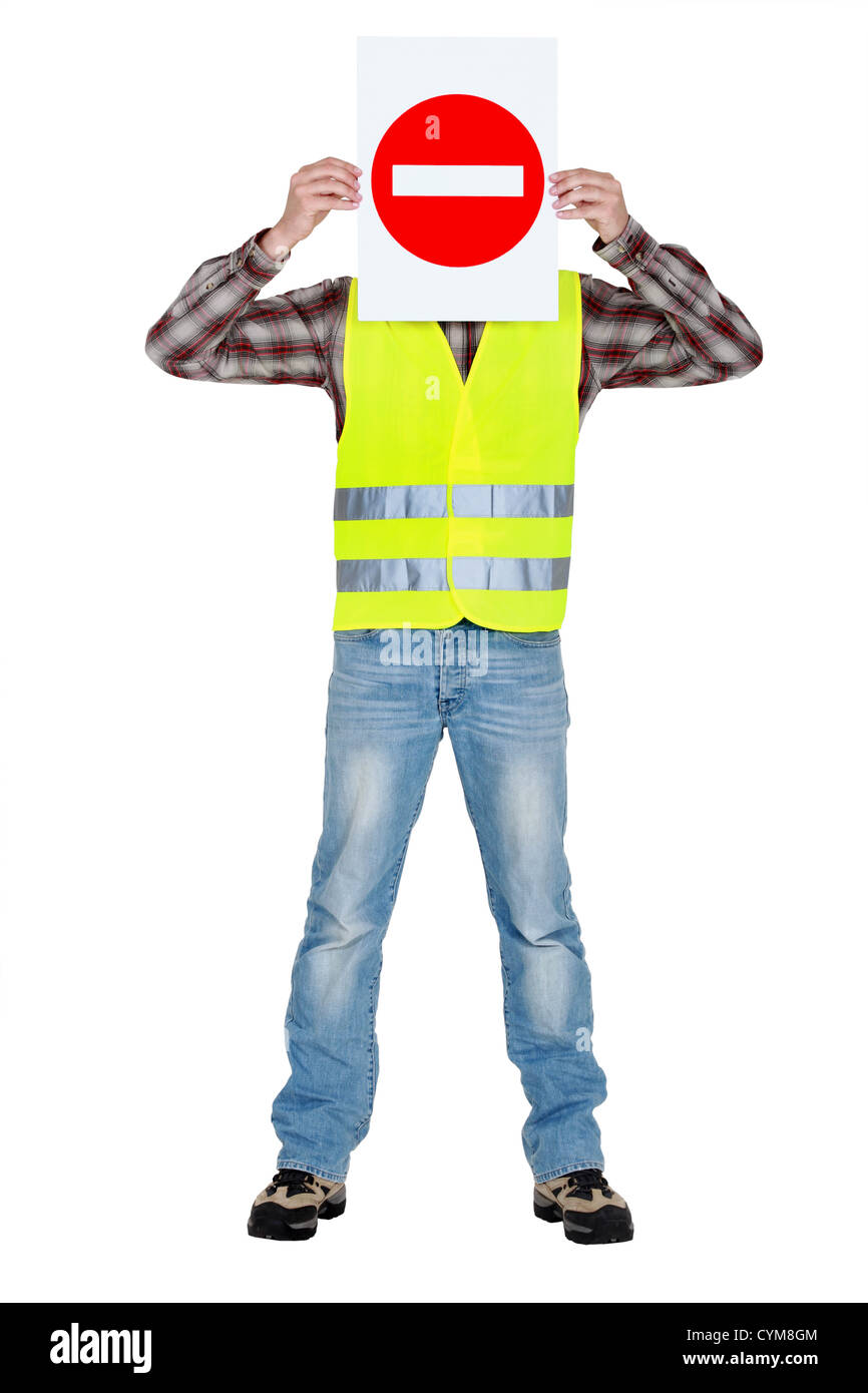 Worker with a No Entry sign Stock Photo - Alamy