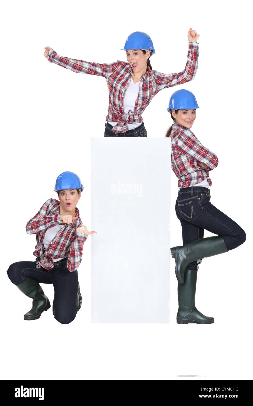 Triplets dancing around a blank sign Stock Photo - Alamy