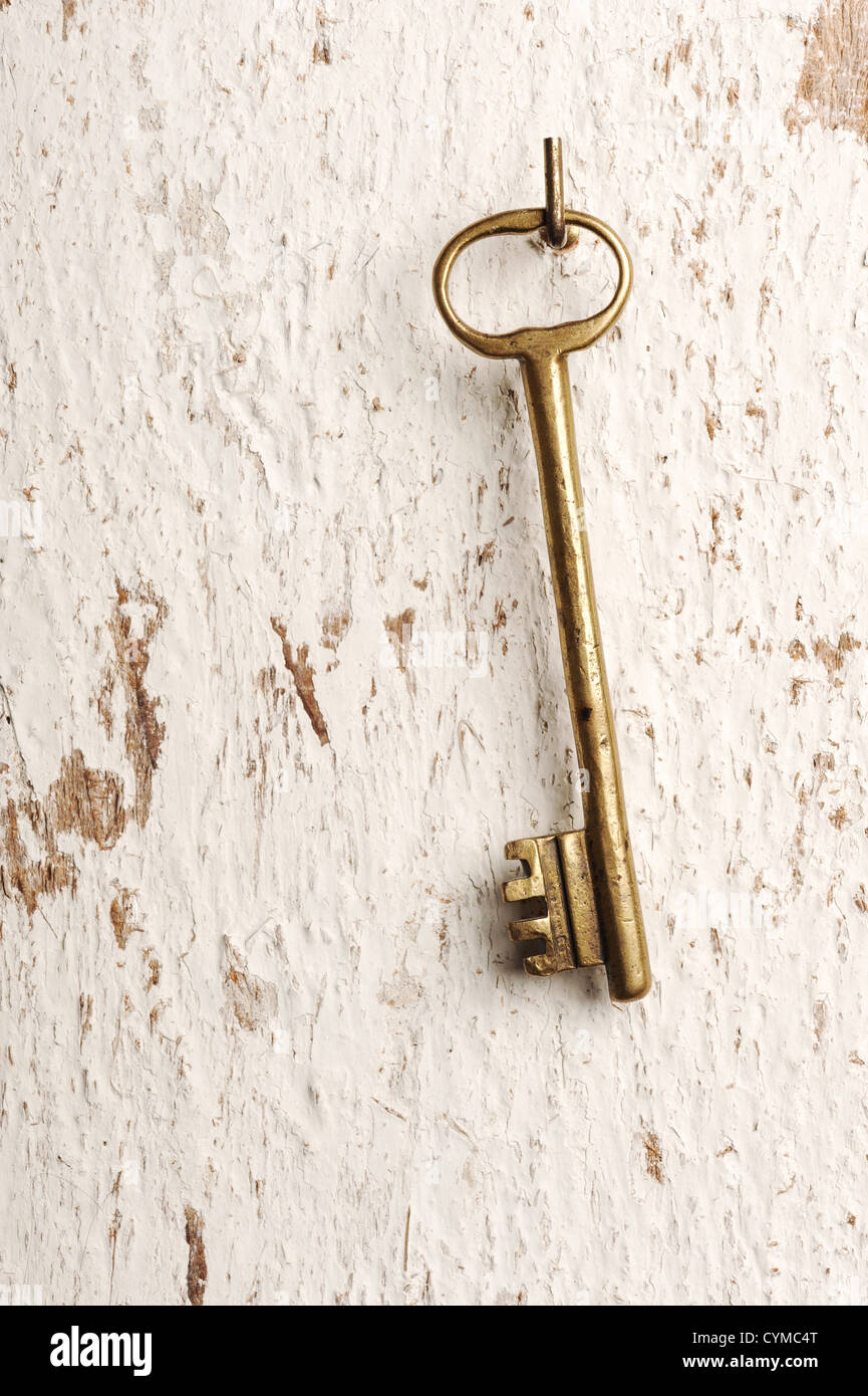old key, wall background Stock Photo - Alamy