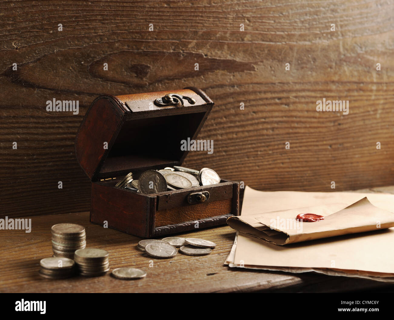 Treasure chest, old coins and mail paper Stock Photo - Alamy