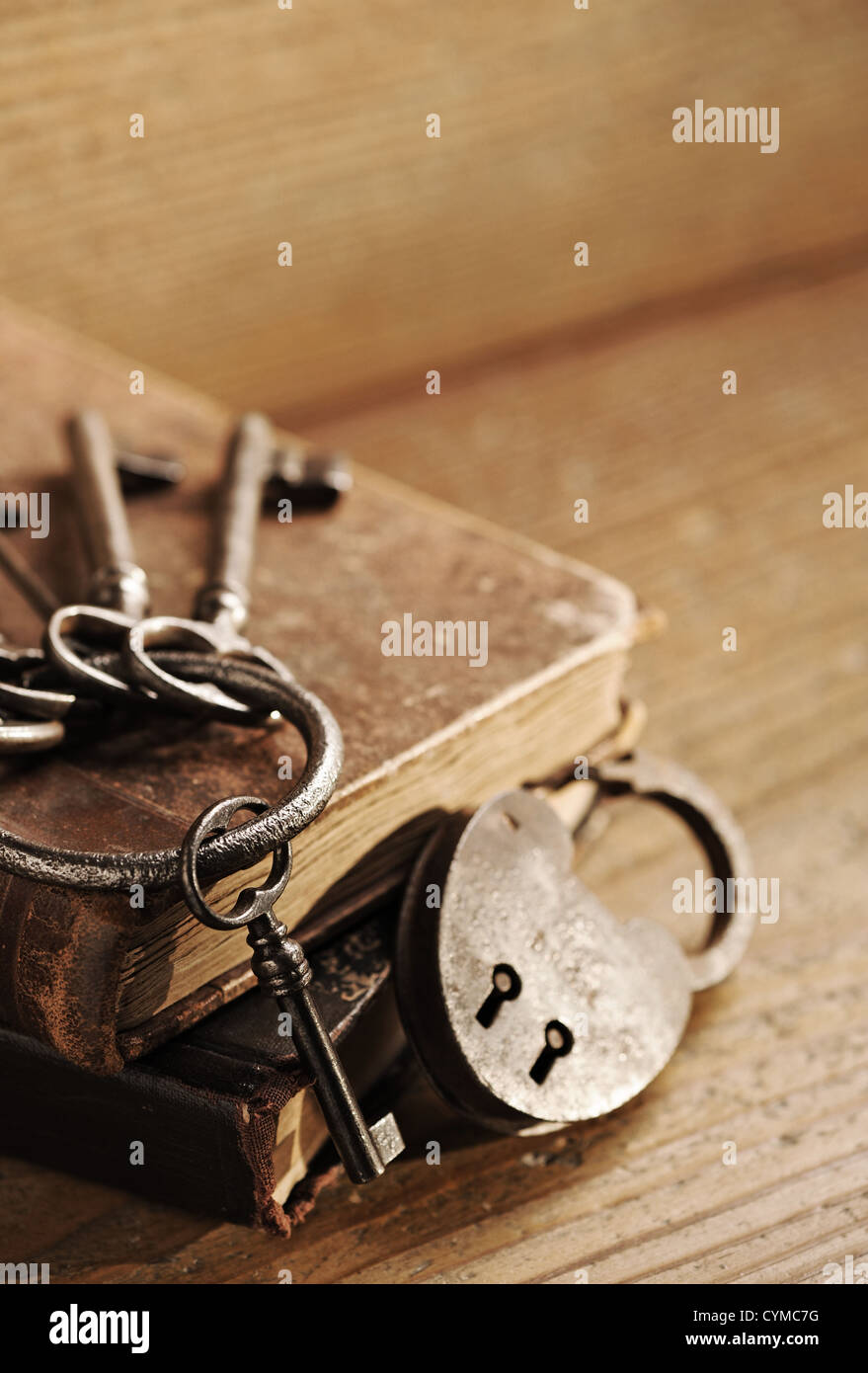 old keys on a old book, antique wood background Stock Photo - Alamy