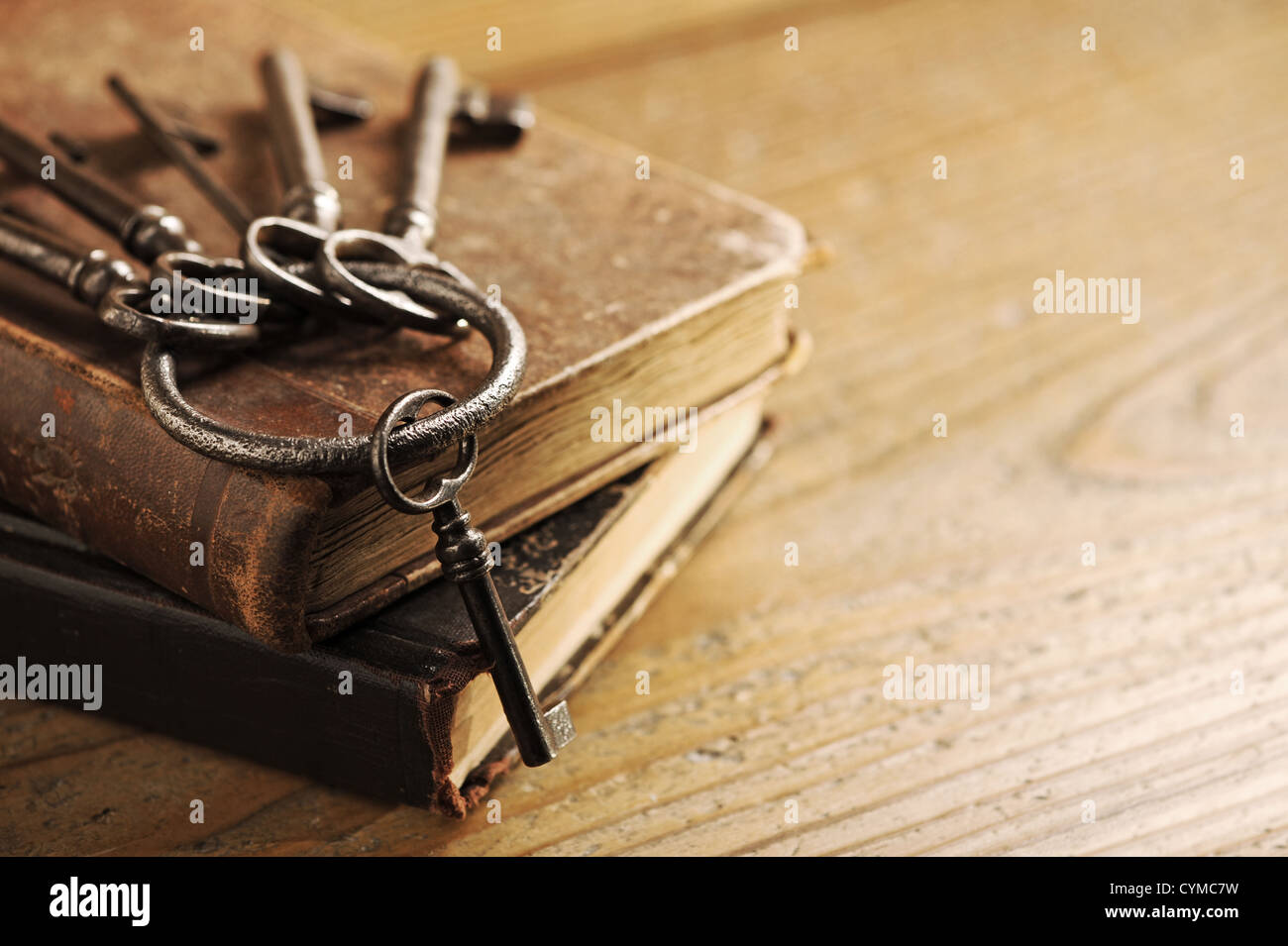 old keys on a old book, antique wood background Stock Photo - Alamy