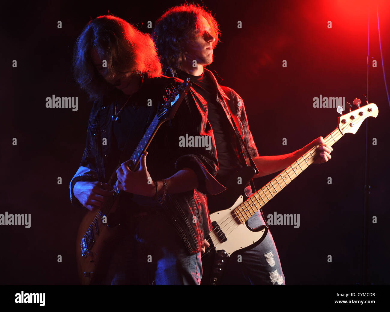 rock musicians playing at a live concert Stock Photo - Alamy
