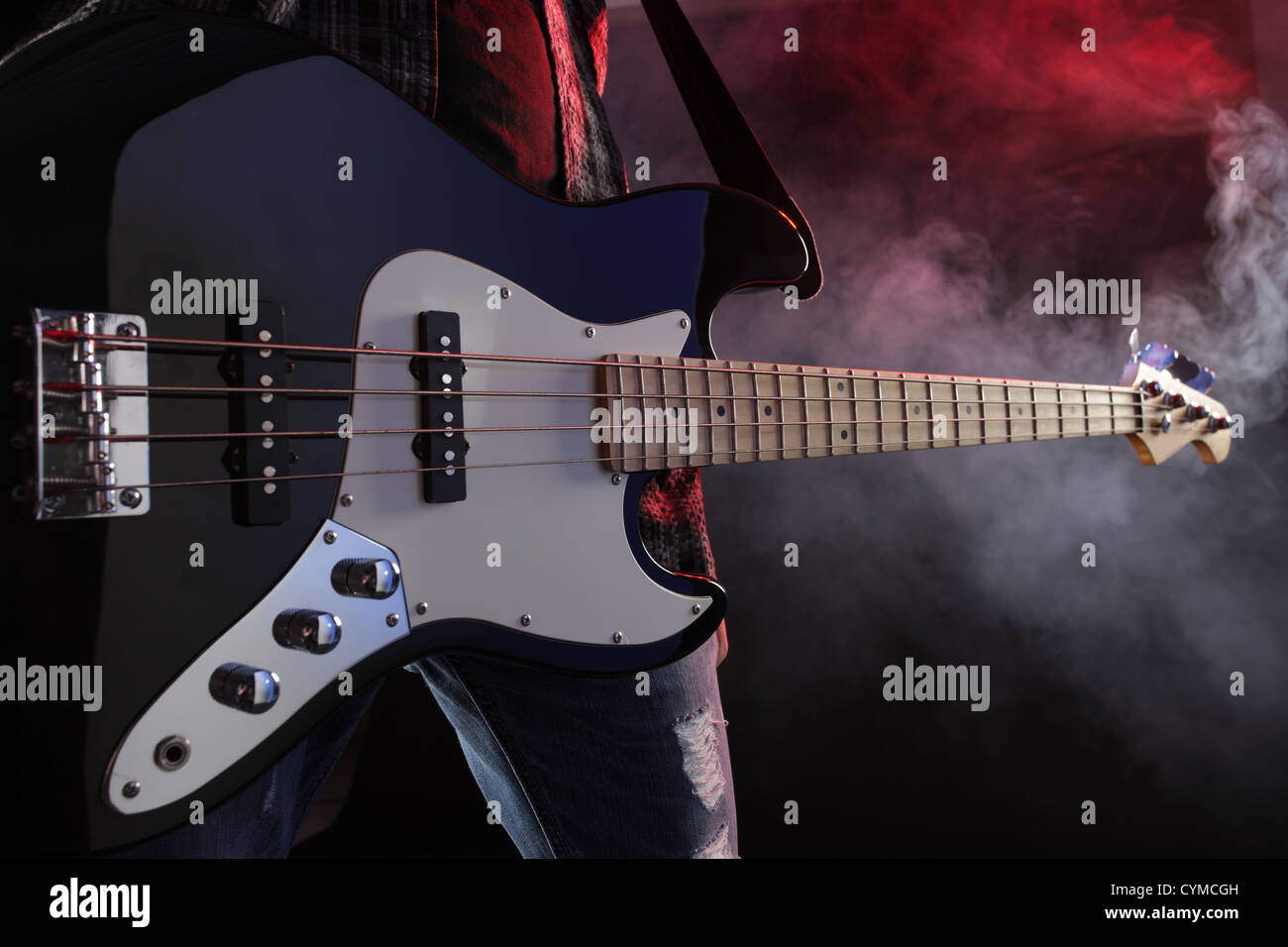 a bassist plays at a live concert Stock Photo - Alamy