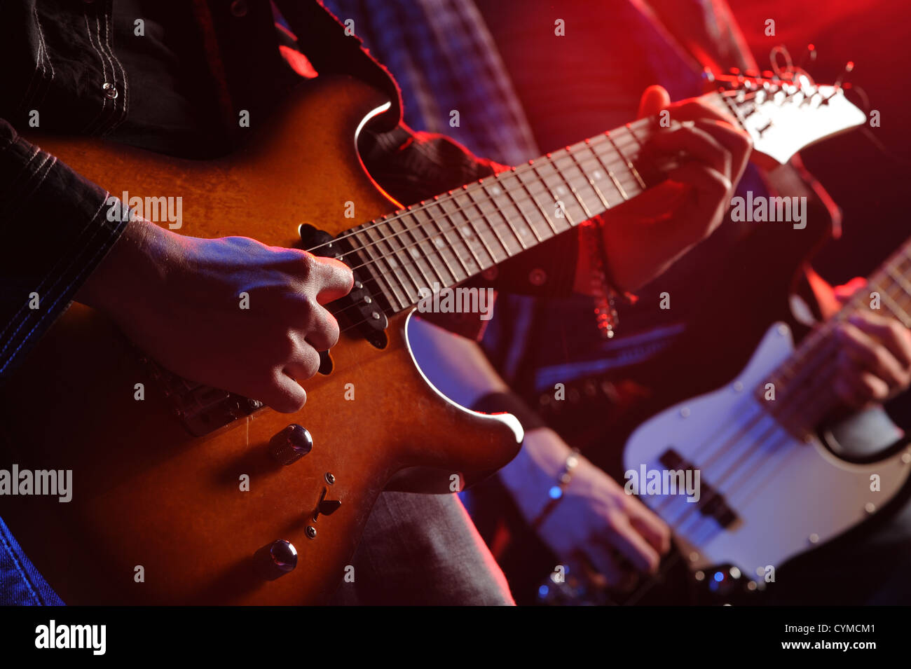 rock musicians playing at a live concert Stock Photo - Alamy