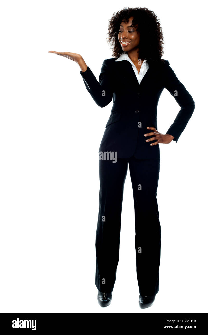 Full length portrait of corporate african lady presenting copy space ...