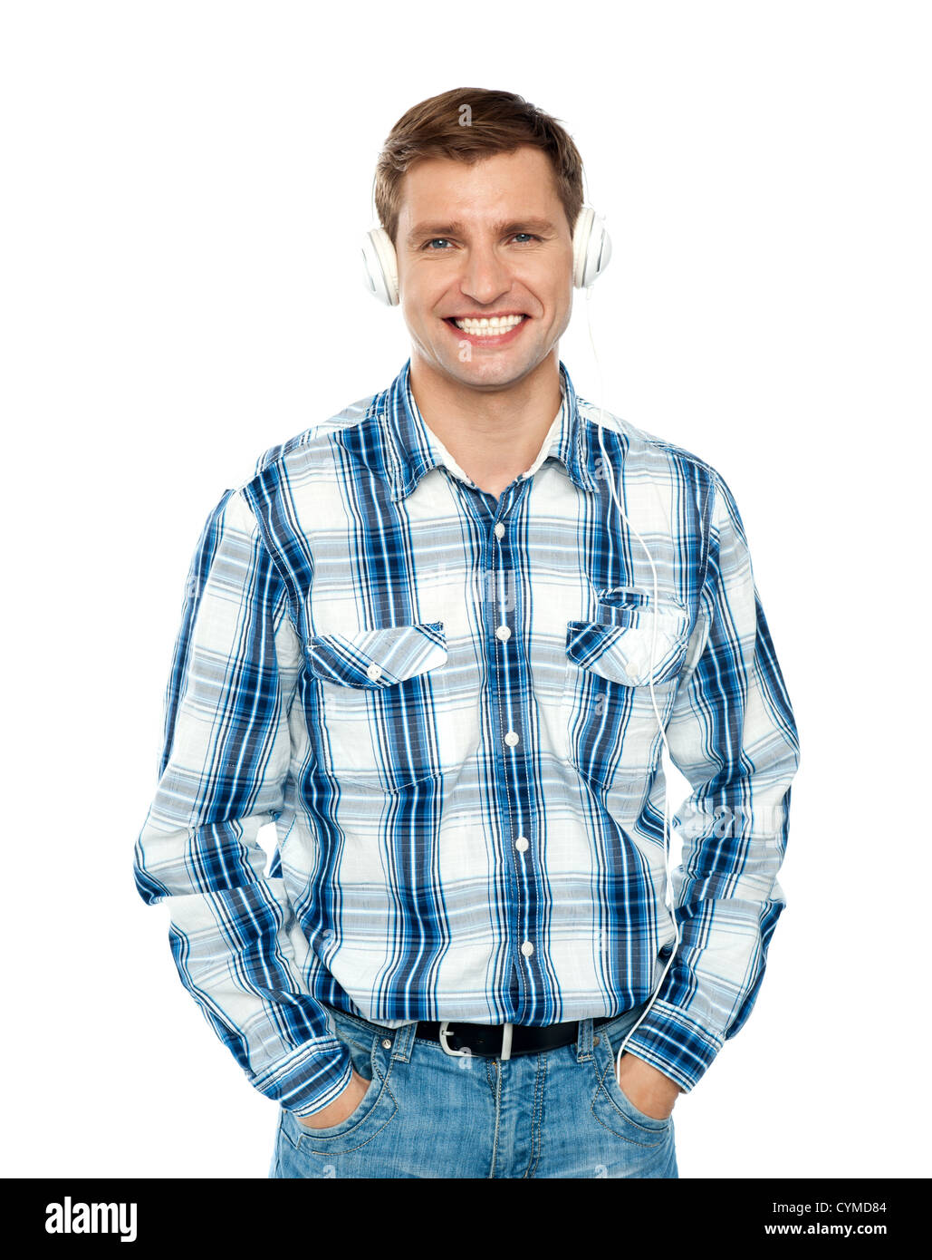 Casual caucasian guy listening to music through headphones posing with ...