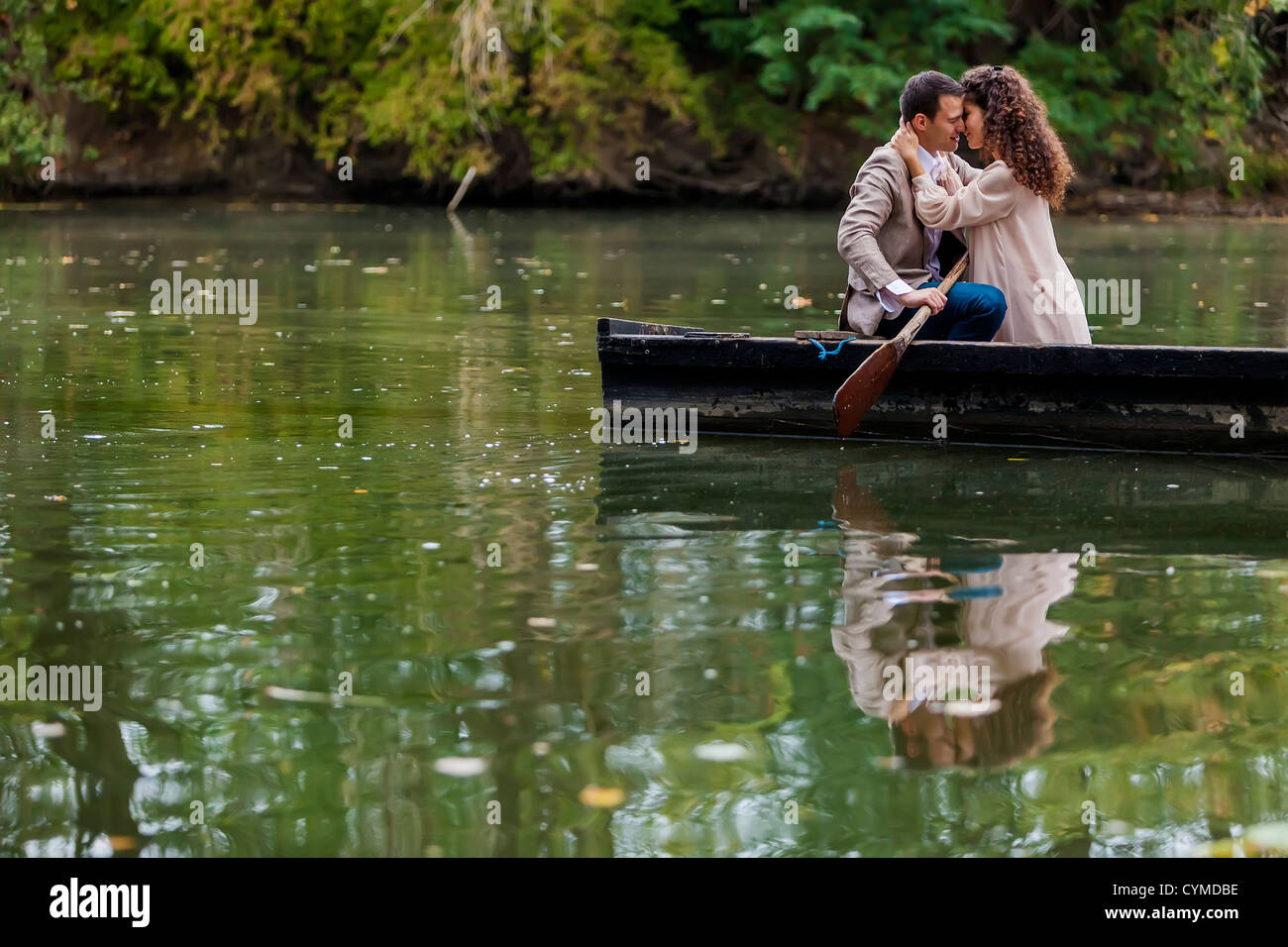 Romantic young couple in the boat Stock Photo - Alamy