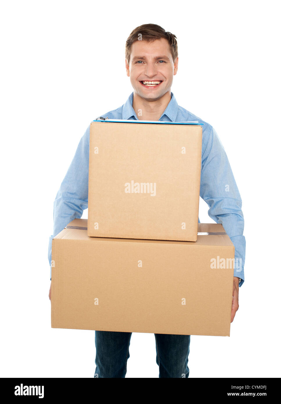 Young man holding cardboard boxes and smiling at the camera Stock Photo ...