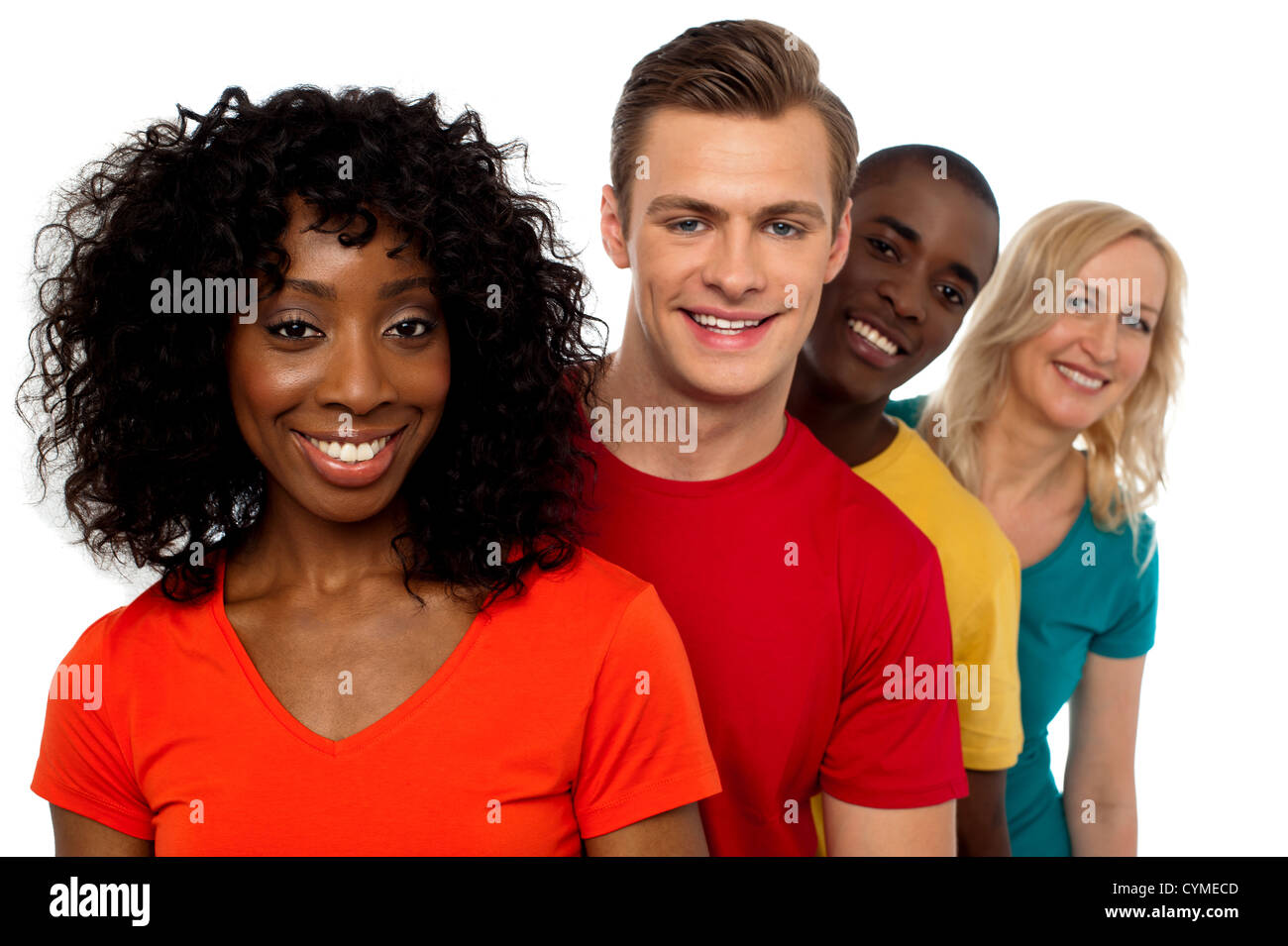 Portrait of smiling group of friends standing behind one another facing ...
