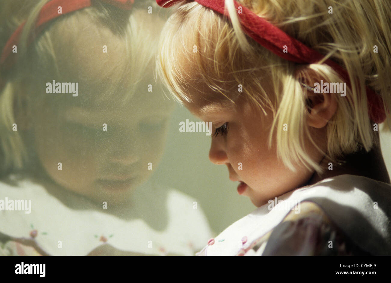 Children, little girl and her reflection Stock Photo - Alamy