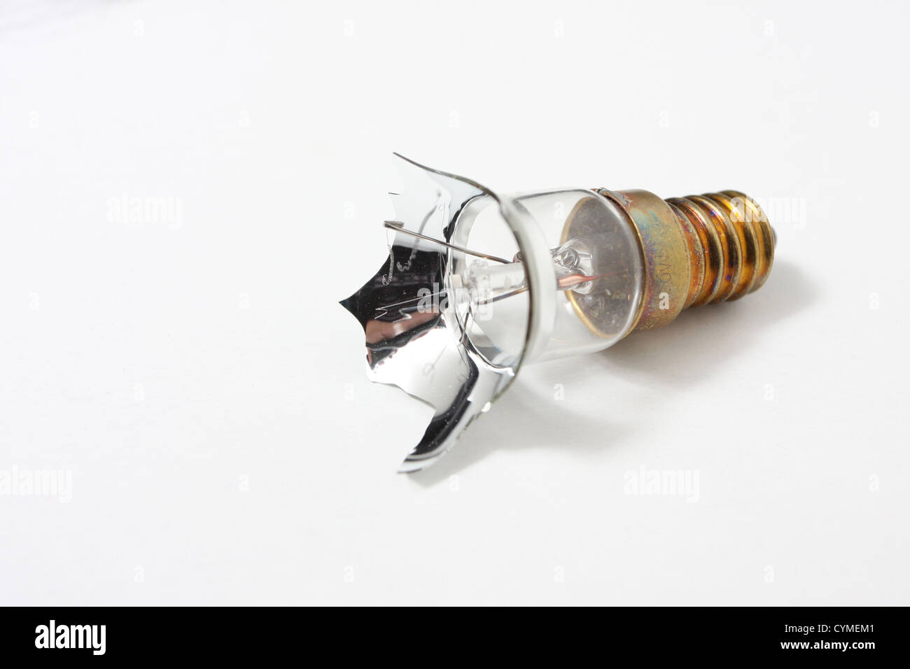 A broken lightbulb shot on white Stock Photo - Alamy