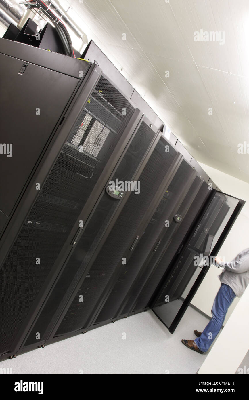 System administrator working on a server in server room Stock Photo - Alamy