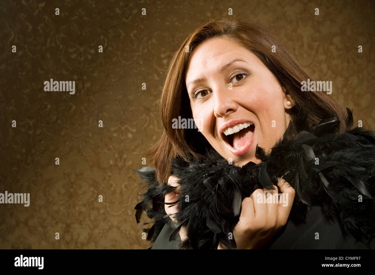 Woman wearing feather boa hi-res stock photography and images - Alamy