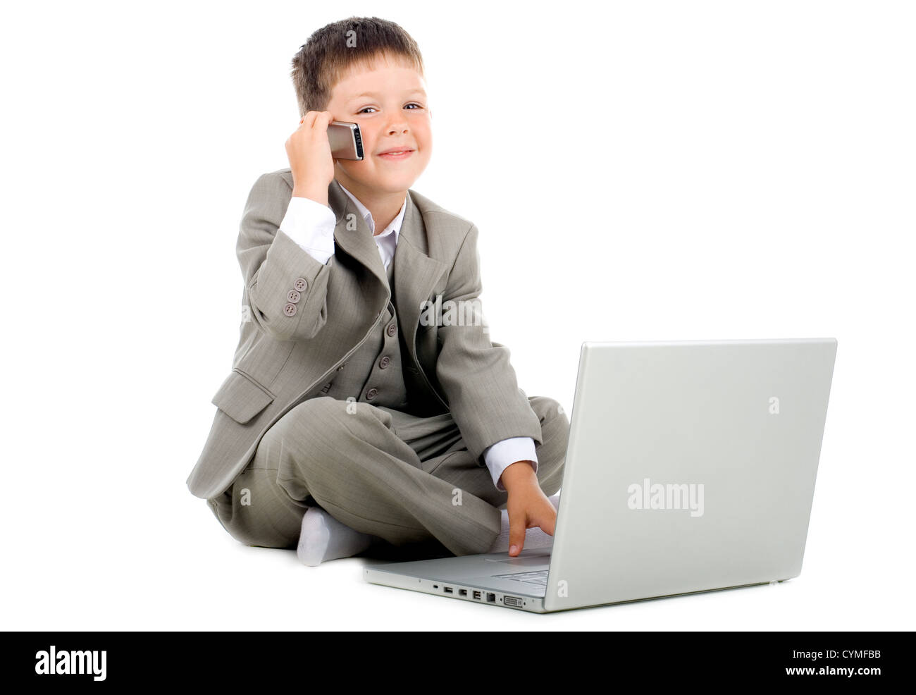 Little kid - businessman sitting with a laptop Stock Photo - Alamy