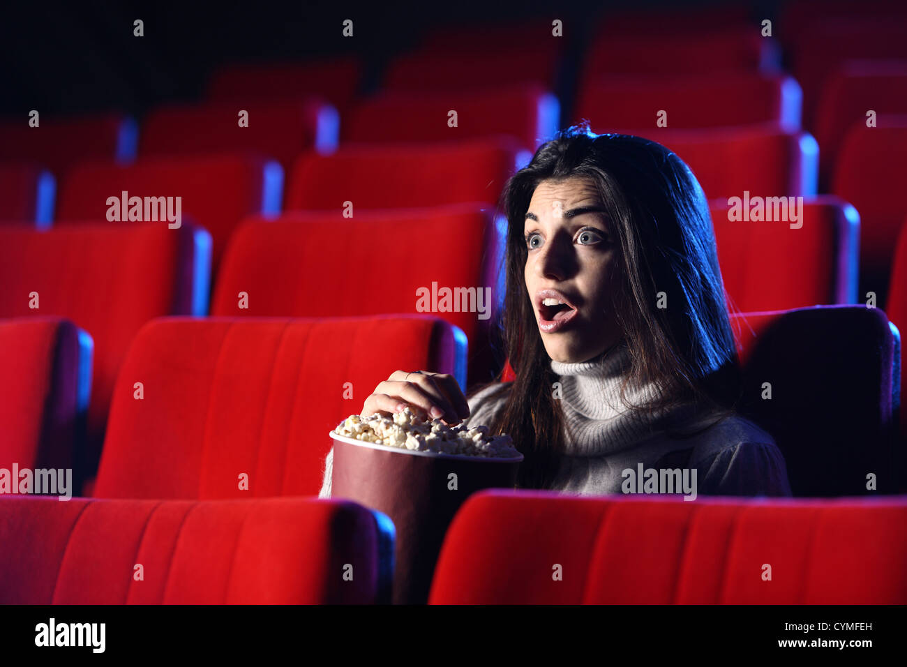 scary movie: portrait of a pretty girl in an empty theater, she has ...