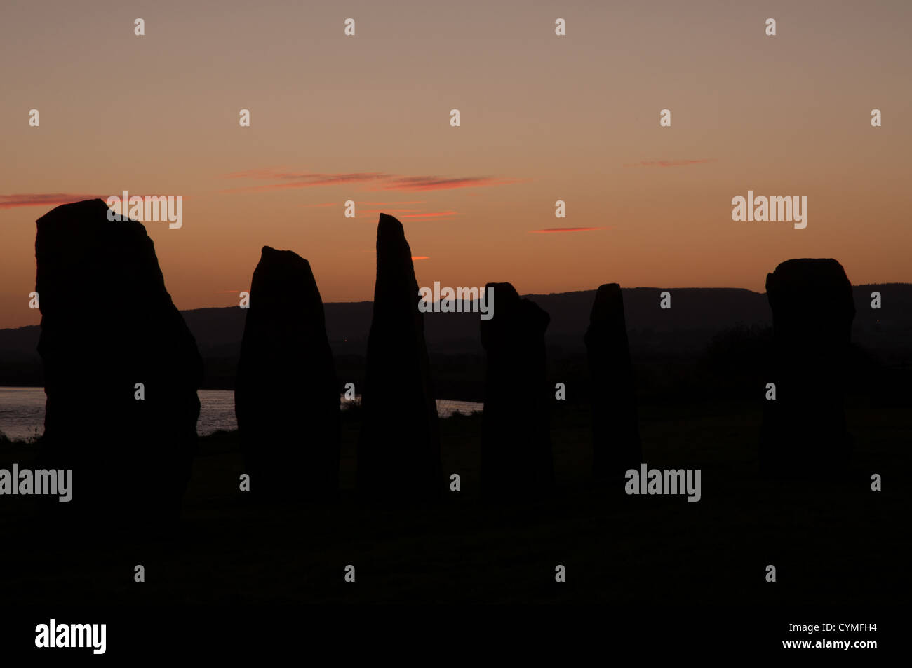 contemporary standing stones at sunset, silhouette Stock Photo - Alamy