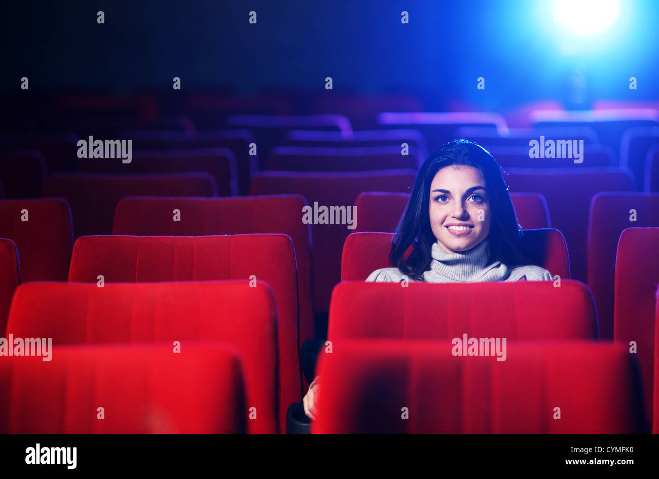 watching a movie at the cinema: portrait of a pretty girl in a movie ...