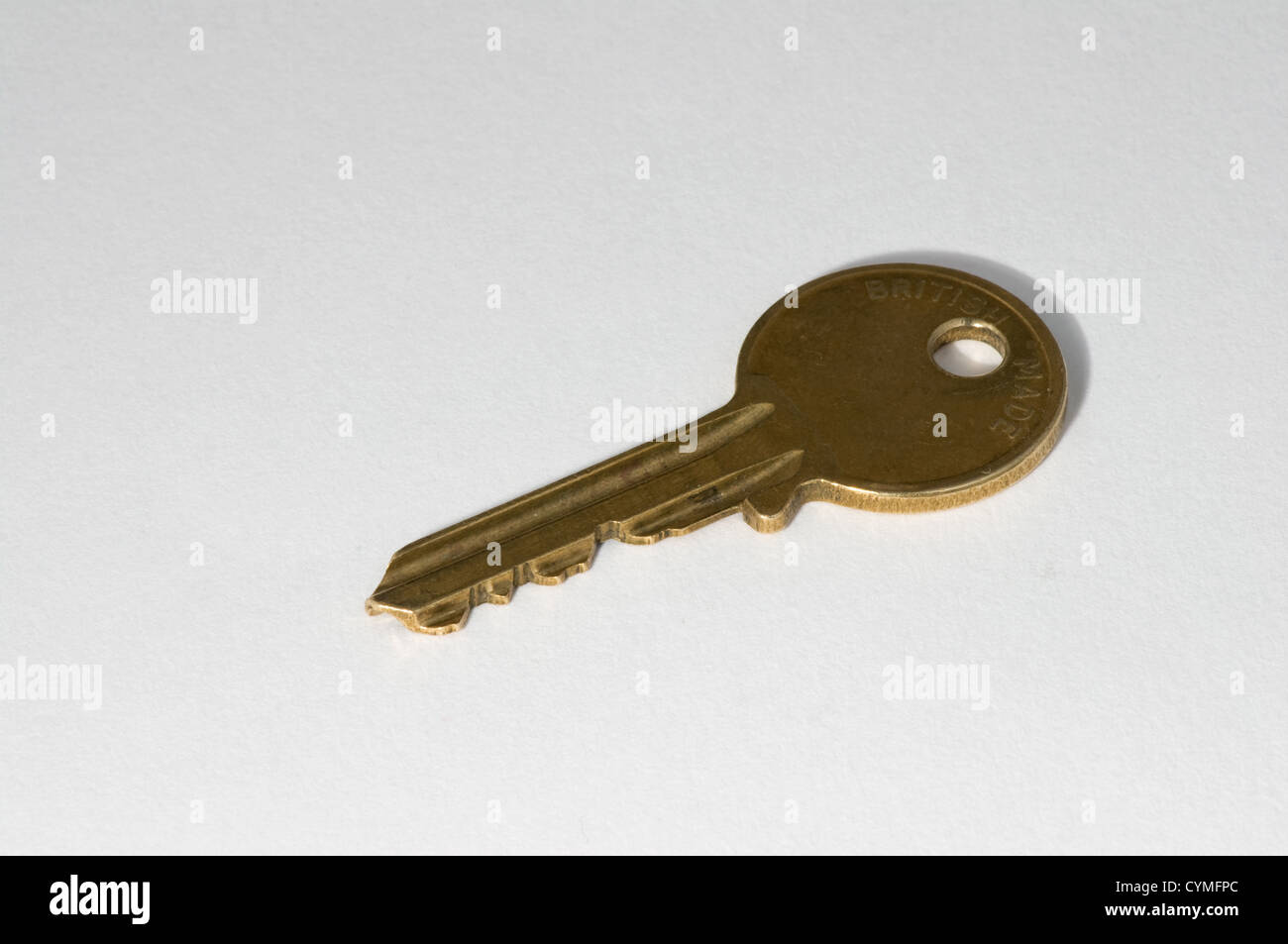Brass coloured door key Stock Photo - Alamy