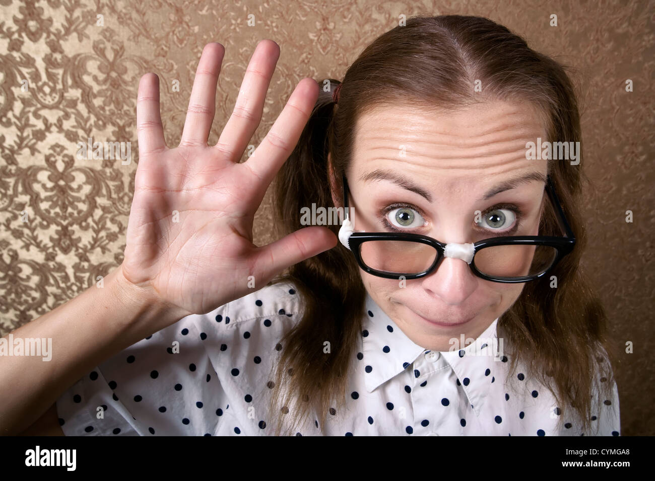 Cute Nerdy Girl Eagerly Raising Her hand Stock Photo - Alamy