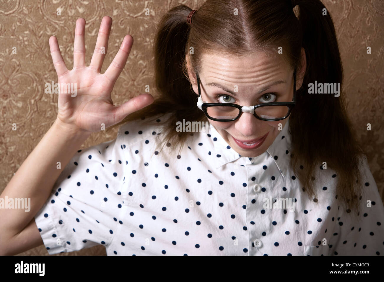 Cute Nerdy Girl Eagerly Raising Her hand Stock Photo - Alamy