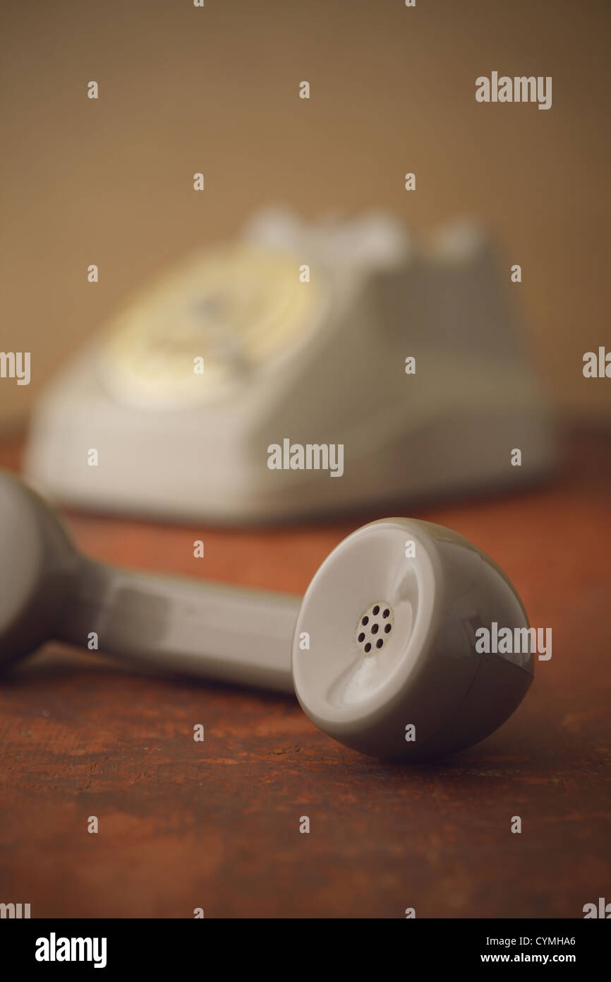 Old-fashioned phone with receiver off Stock Photo - Alamy