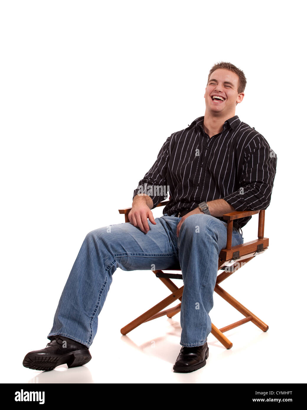 Man sitting on directors chair hi-res stock photography and images - Alamy
