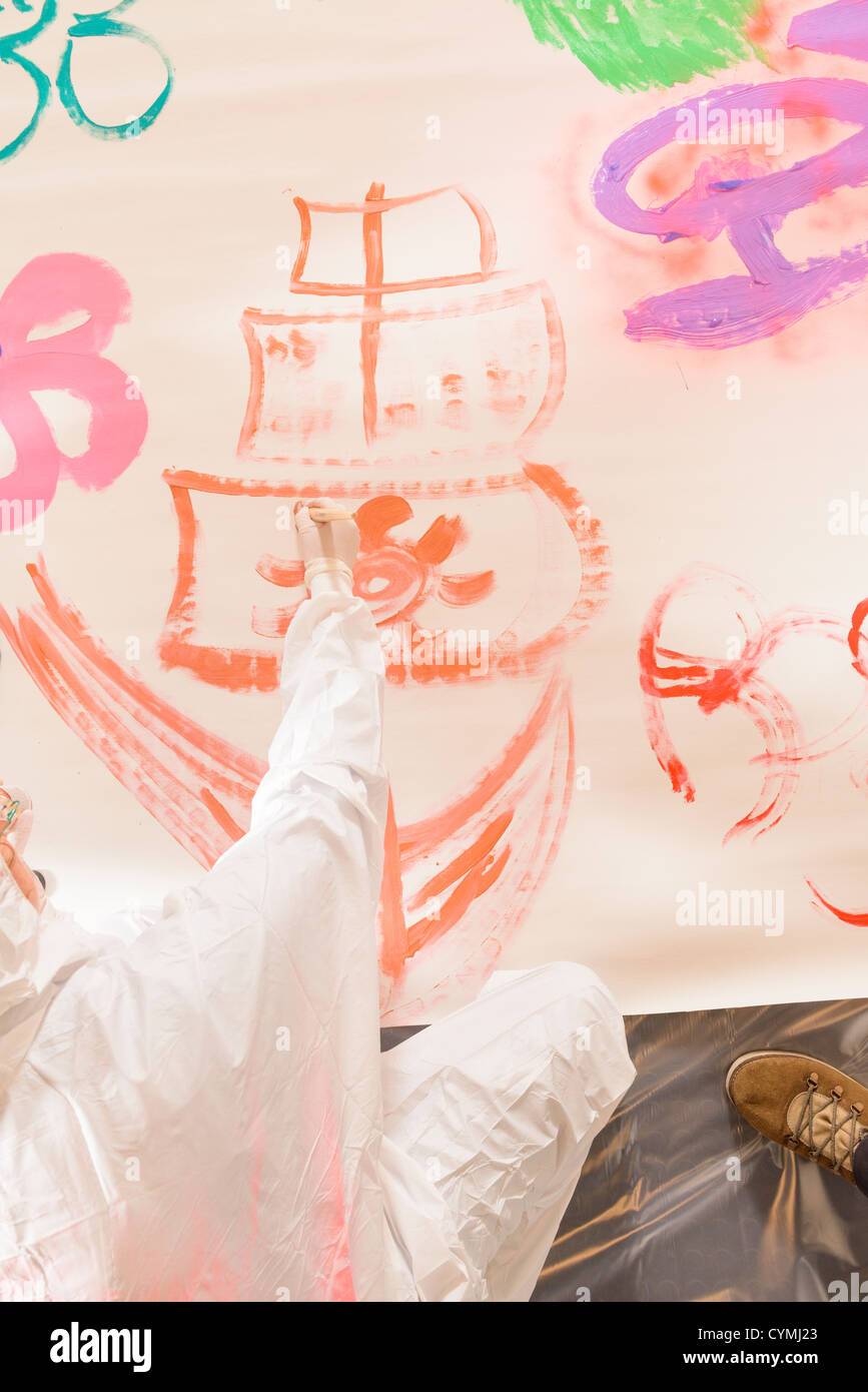 People having fun during art therapy session drawing paint Stock Photo ...