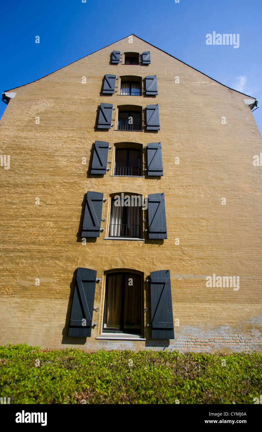 Side of a house with shape of arrow Stock Photo - Alamy