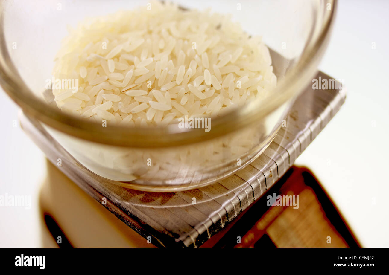 Rice being weighed on scale Stock Photo - Alamy