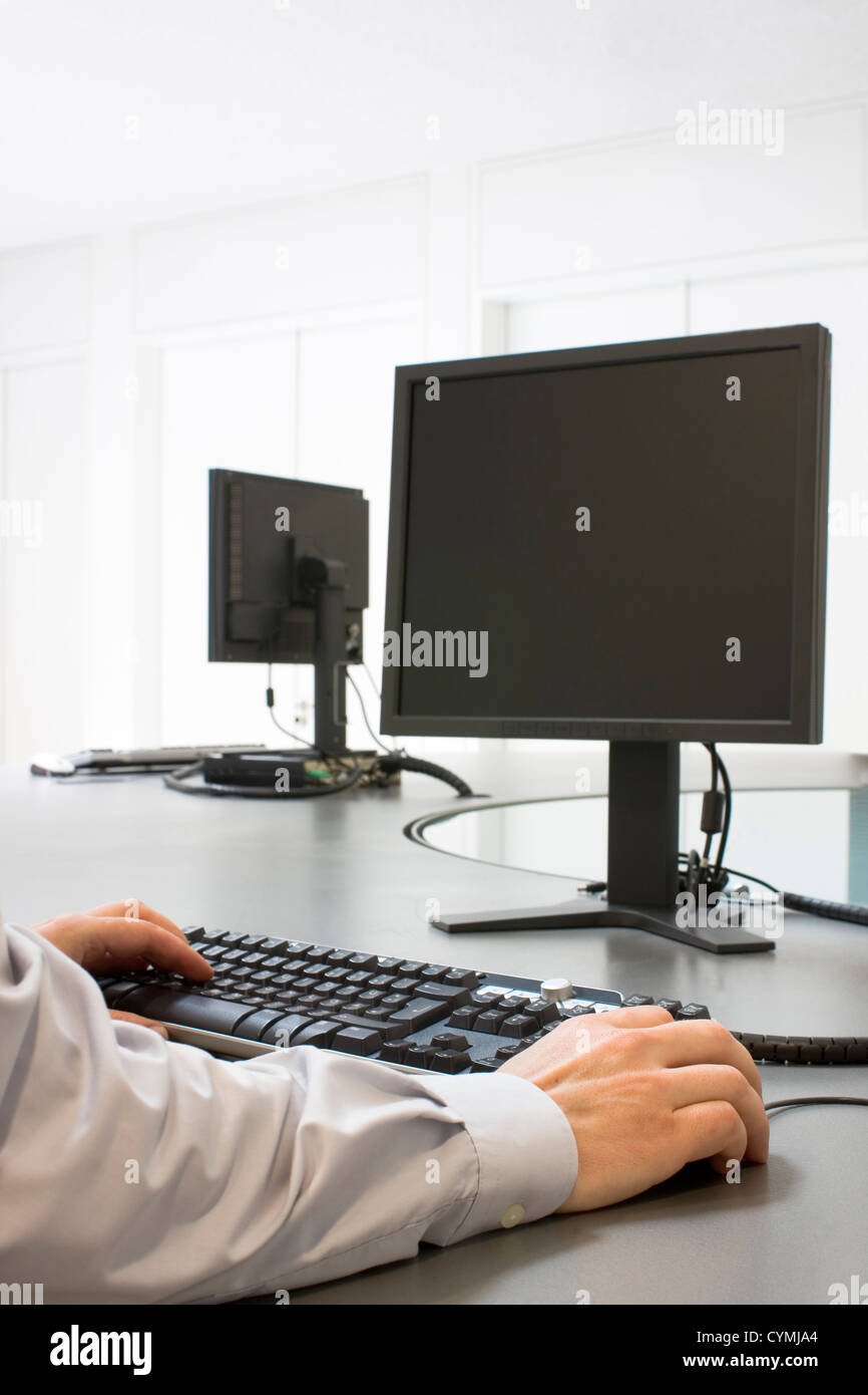 Hands working with computer mouse and keyboard Stock Photo - Alamy