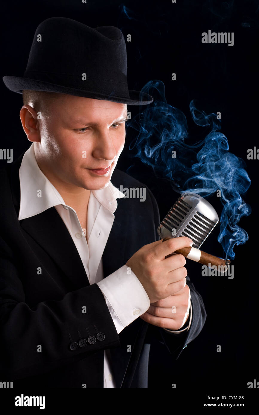 Jazzman and retro microphone in suit and hat Stock Photo - Alamy