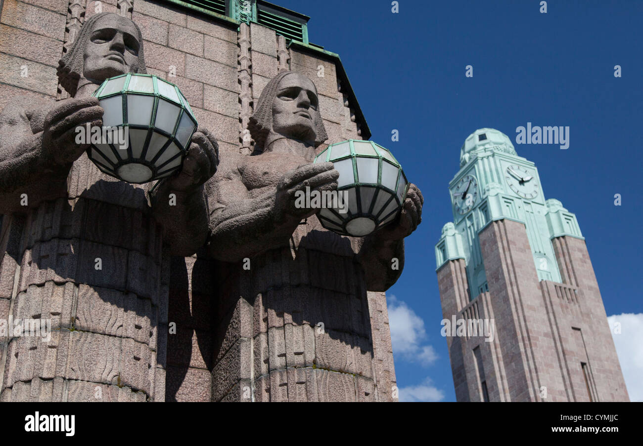 Clock tower and statues of the Helsinki Finland Central Railway Station ...