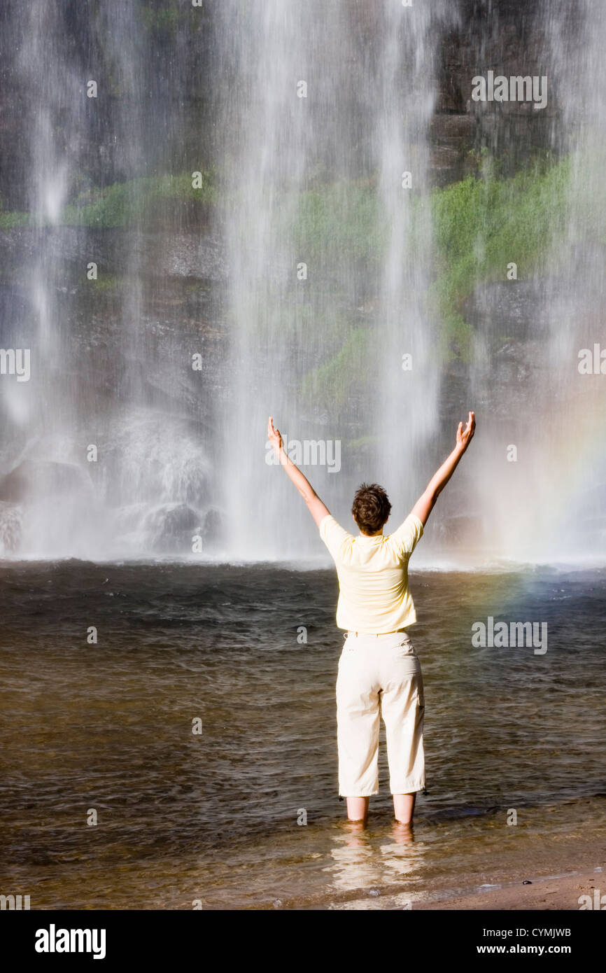 Person standing waterfall hi-res stock photography and images - Alamy