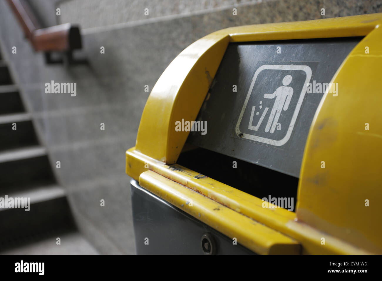 yellow garbage can close up Stock Photo - Alamy